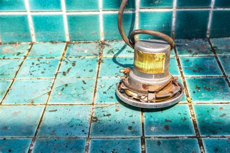 Old And Rusty Pool Light On Swimming Pool Floor Illumination System For Swimming Poo Stock