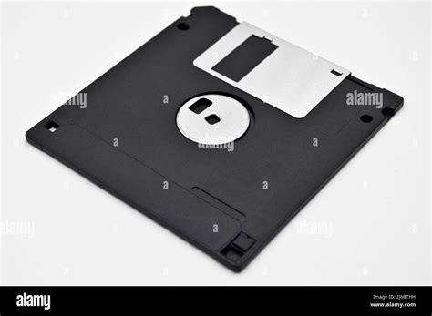 Old Computer And Data Storage Technology Black Plastic Magnetic Floppy Disk 3½ Inches Isolated