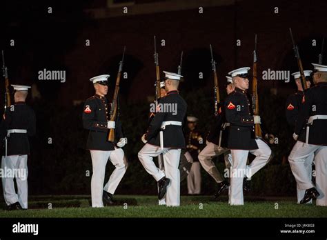 The Marine Corps Silent Drill Platoon Performs During An Evening Parade