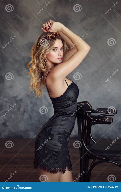 Attractive Fashion Model In Black Lingerie With Crown Stock Image