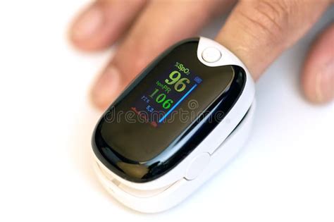 pulse oximeter reading an up close shot reveals a finger with a pulse