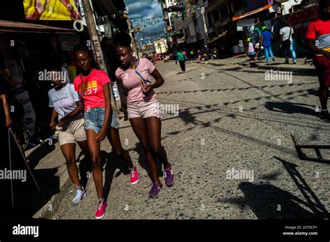 Afro Colombian Girls Walk On The Street During The San Pacho Festival