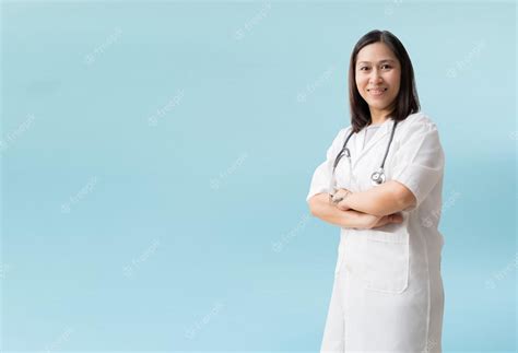 Premium Photo Smiling Asian Female Doctor Coat With Posing Arms