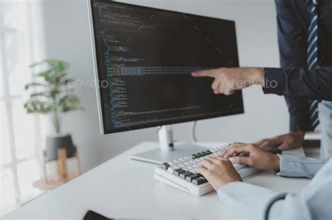 Two Programmers Looking At Computer Screen Programmer Design Custom
