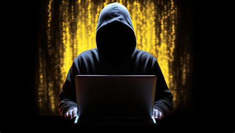 a hooded figure cloaked in shadow illuminated by the eerie glow of a