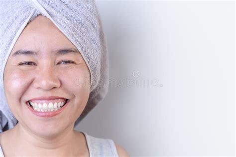 Close Up Of A Happy Asian Woman With A Towel On Her Head Smiling Cheerfully Healthy Skin Stock