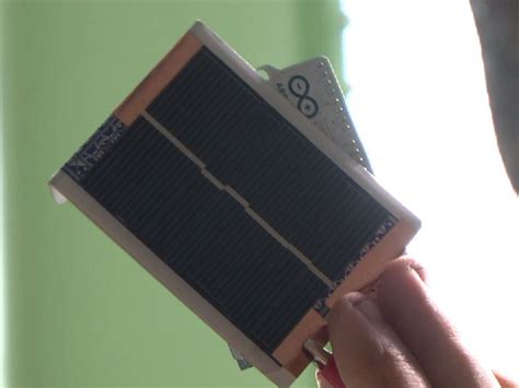 Solar Powered Arduino On The Back Of A Playing Card