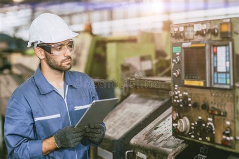 hispanic latin indian male worker working control operate lathe cnc
