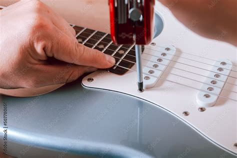 Guitar Master Changing Or Making Electric Guitar Pickup Height Measurements Stock Photo Adobe