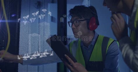 image of graphs over diverse woman and man working in server room stock