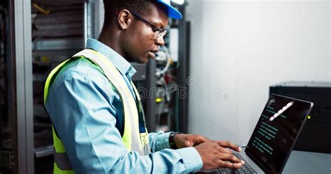 Man Maintenance And Server Room Or Coding With Laptop Electrician And Firmware Update