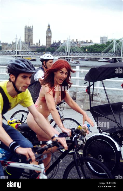 Naked Woman Cycling Between Two Clothed Men On Westminster Bridge