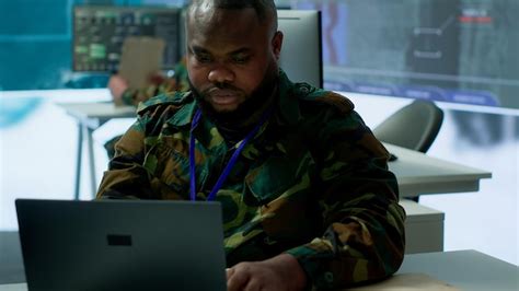 Free Photo It Analyst In A High Tech Base Of Operations Handling Surveillance Activity