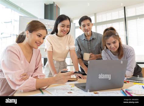 Ux Developer And Ui Designer Presenting And Testing Mobile App