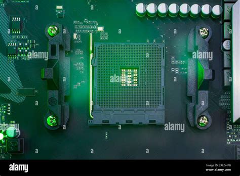 Сomputer component is motherboard without processor View from above Green tinted Stock Photo