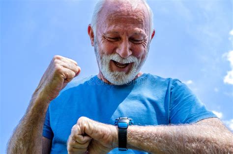 Portrait Of A Senior Man Checking His Watch Stock Image Image Of Heart Health 271205121