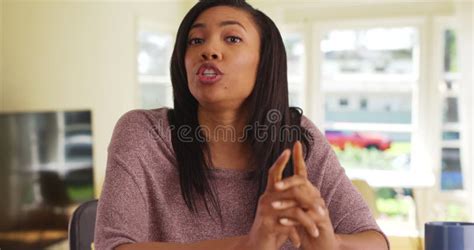 Black Female Shielding Herself From Freak Rain With Laptop On Urban