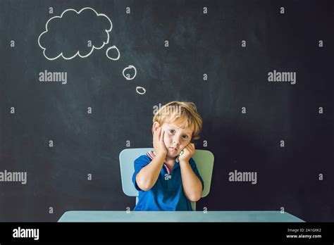Closeup Portrait Of Cute Little Boy Thinking Deeply About Something