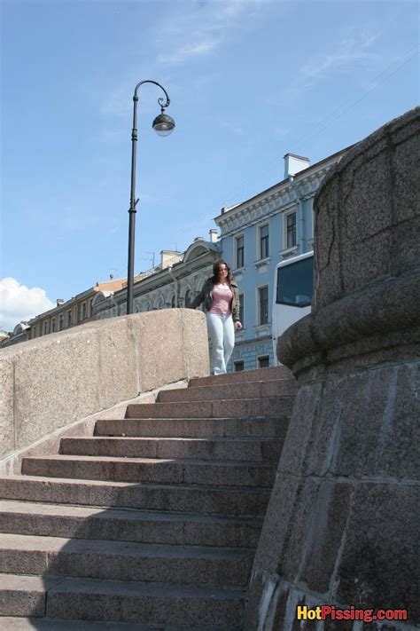 Big Boobed Beauty In Jeans Squats And Voids Her Bladder In The Street Porn Pictures XXX Photos