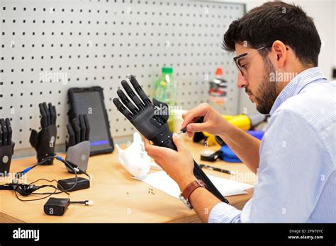 Lviv Ukraine April 14 2023 A Doctor Holds A Prosthetic Arm During