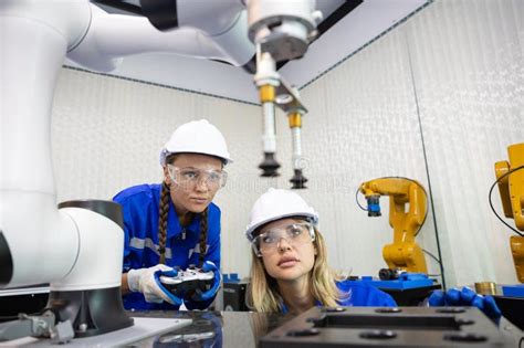 Technician Engineer Using Remote Control Automation Robotics At Industrial Modern Lab Factory