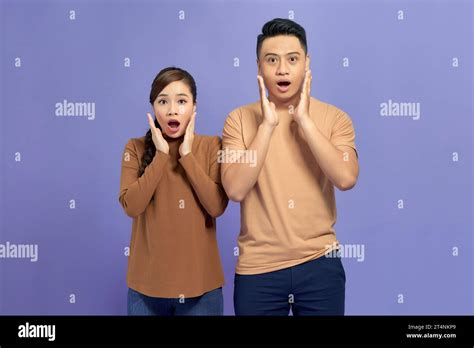 Photo Of Young Cheerful Husband Wife Excited Hands Touch Cheeks Good Information Reaction Stock