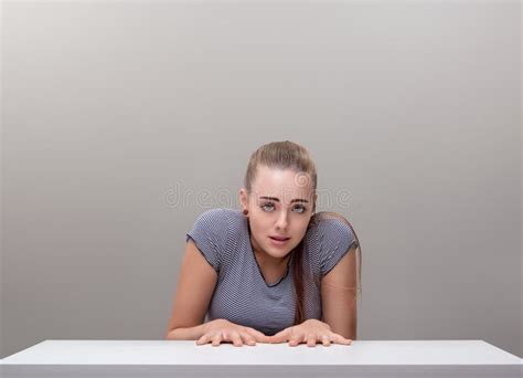 Eaning In Her Tense Posture Screams Apprehension Stock Image Image Of Young Hesitant 303804325