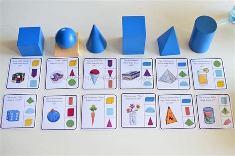 A Table Topped With Different Types Of Shapes And Numbers On Cards Next