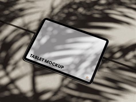 그림자가 있는 콘크리트 위의 태블릿 프리미엄 Psd 파일