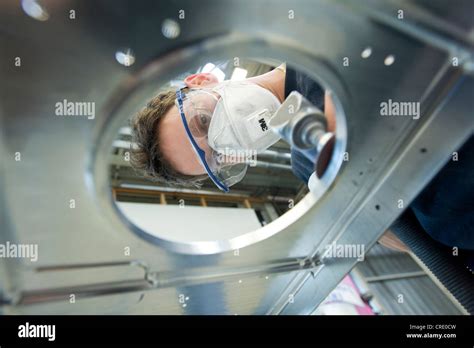 Worker Burring Trimming Milled Parts Prefabrication Beams For The Floor Unit Premium Aerotec