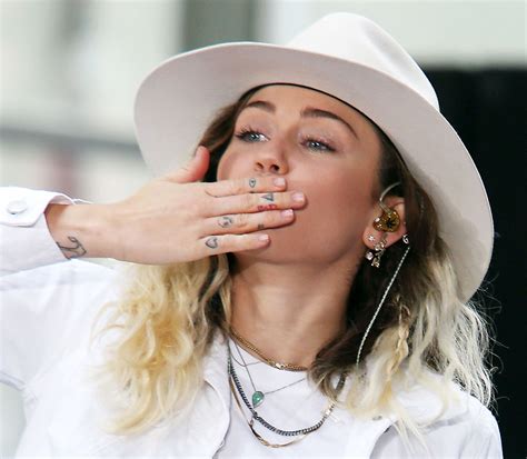 Miley Cyrus Tattoo Guide Photos Of Her Body Ink Meanings