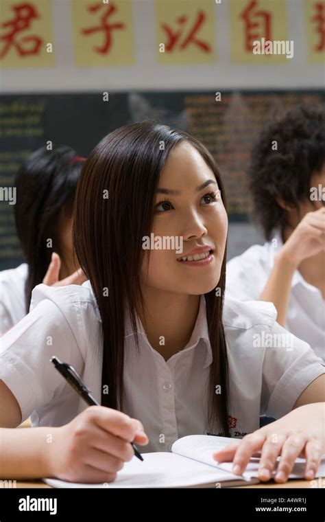 Female Babe Taking Notes In Class Stock Photo Alamy