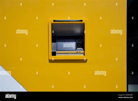Automated Teller Machine Atm Cash Dispenser On Yellow Wall Account Balances Withdraw