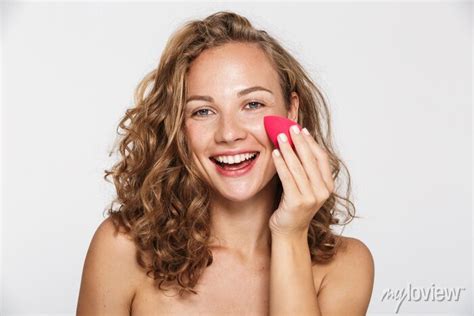 Image Of Pleased Half Naked Woman Laughing And Using Facial Sponge
