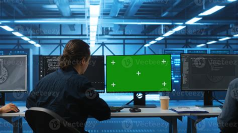It Support Workers In Data Center Coding On Green Screen Computers Upgrading Equipment