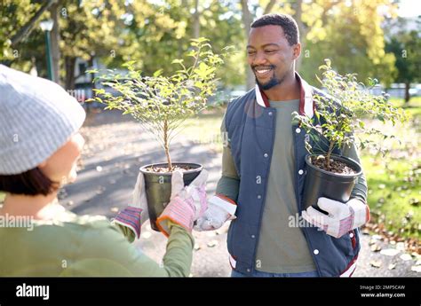 Teamwork Gardening And Man With Woman In A Park Happy And Smiling For