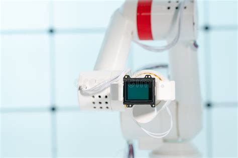 Robot Arm With Ccd And Cmos Matrix Image Sensor In The Manipulator Concept On The Topic Of