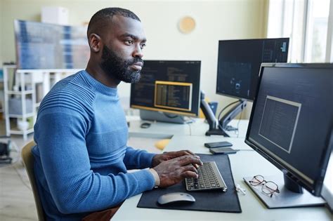 Premium Photo Side View Portrait Of African American Man As Computer Programmer Writing Code