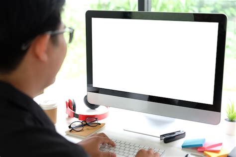 Premium Photo Man Using Laptop On Table