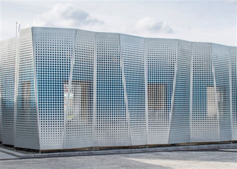 Perforated Metal Covers The Facade Of This Office Extension