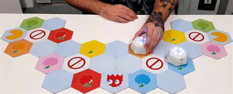 User Playing The Tangible Pacman Game With The Cellulo Robots On The Download Scientific