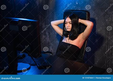 Young Excited Girl Gamer Winning Video Game Sitting On A Chair At Home