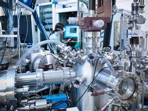 Materials Science Chamber With A Scientist Looking At Beamline Hhg