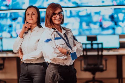 Group Portrait Of Female Security Operator While Working In A Data System Control Room Offices