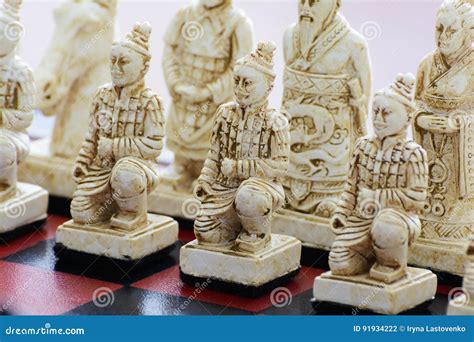 Carved Chess Pieces In Chinese Style On A Chessboard Stock Photo Image Of Decision Game