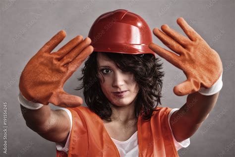 Sexy Girl In Safety Helmet Showing Stop Sign Stock Photo Adobe Stock