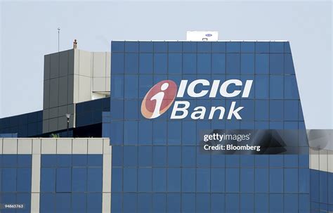 The Logo Of Icici Bank Ltd Is Displayed On The Banks Building In