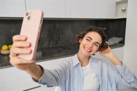 Premium Photo Portrait Of Beautiful Young Woman Taking Selfie On