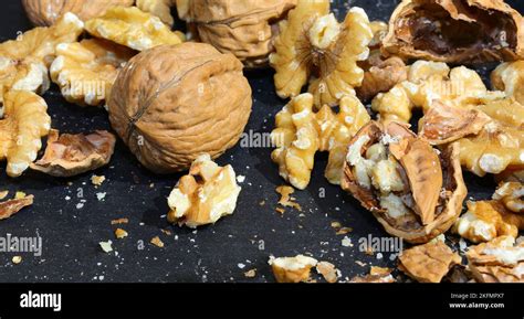 Broken Shells Of Walnuts With The Edible Kernel Inside Stock Photo Alamy