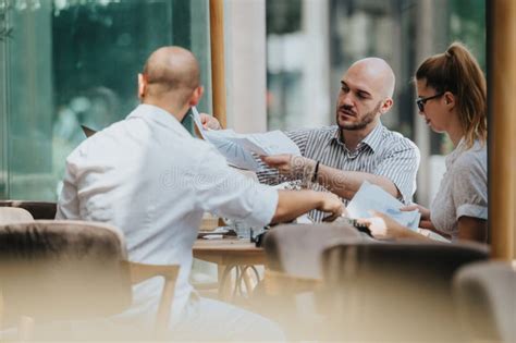Startup Team In Business Meeting Discussing Brainstorming Analyzing And Strategizing Ideas